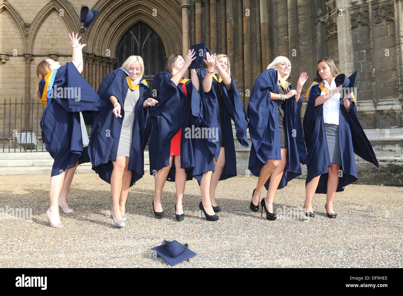 Graduation gowns with mortar board hats hi-res stock photography and ...