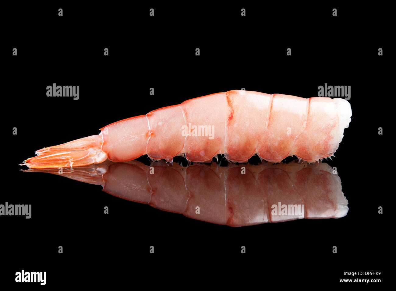Raw shrimp tail isolated on black background Stock Photo - Alamy