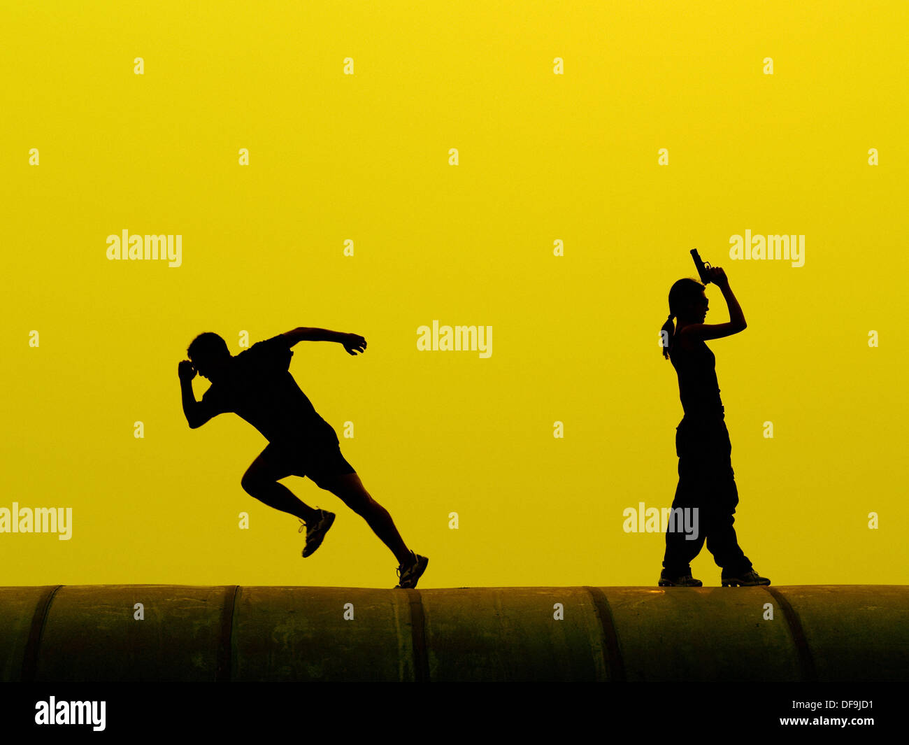Woman silhouette running gun hi-res stock photography and images - Alamy