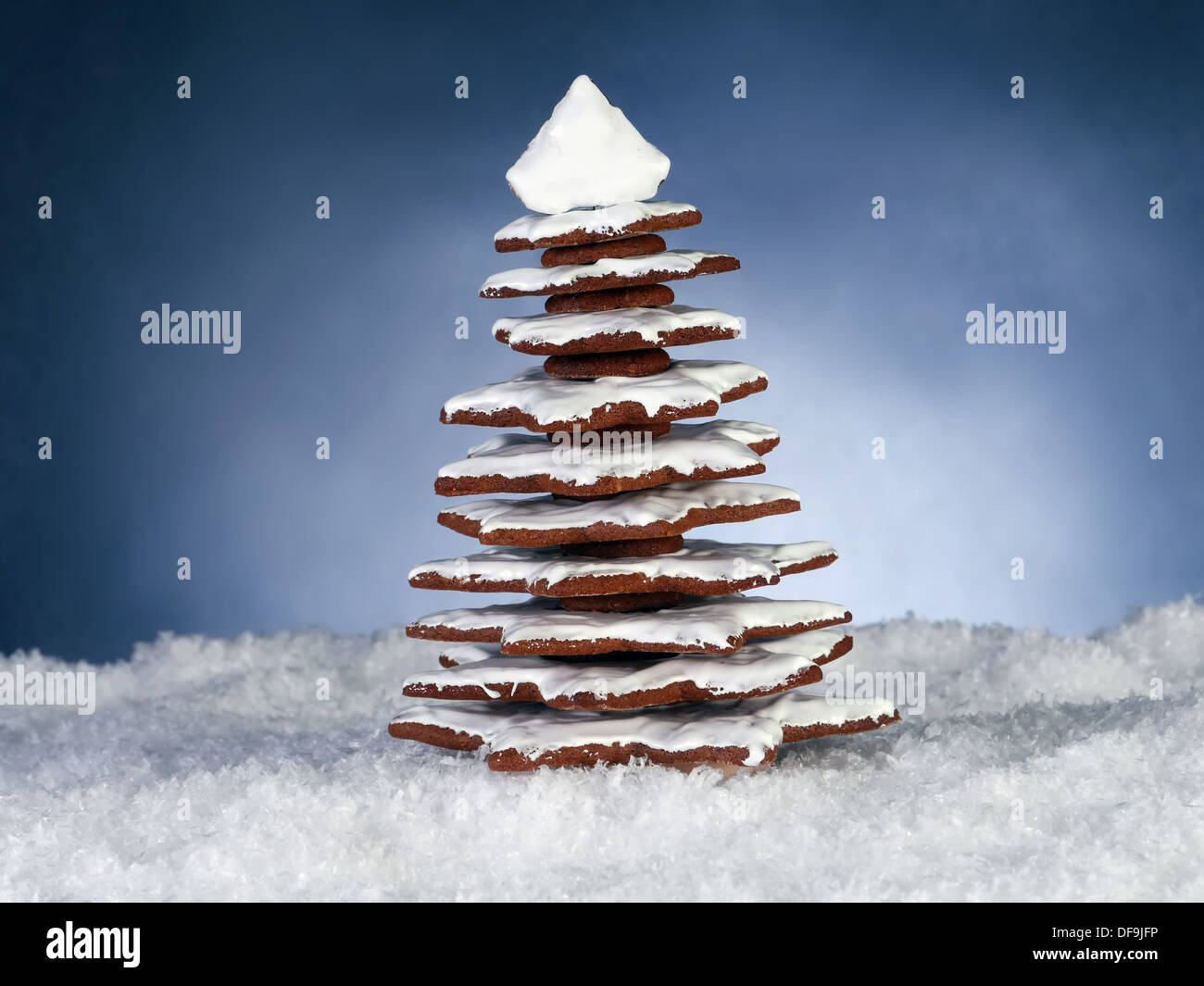 Gingerbread christmas tree over dark blue background Stock Photo - Alamy