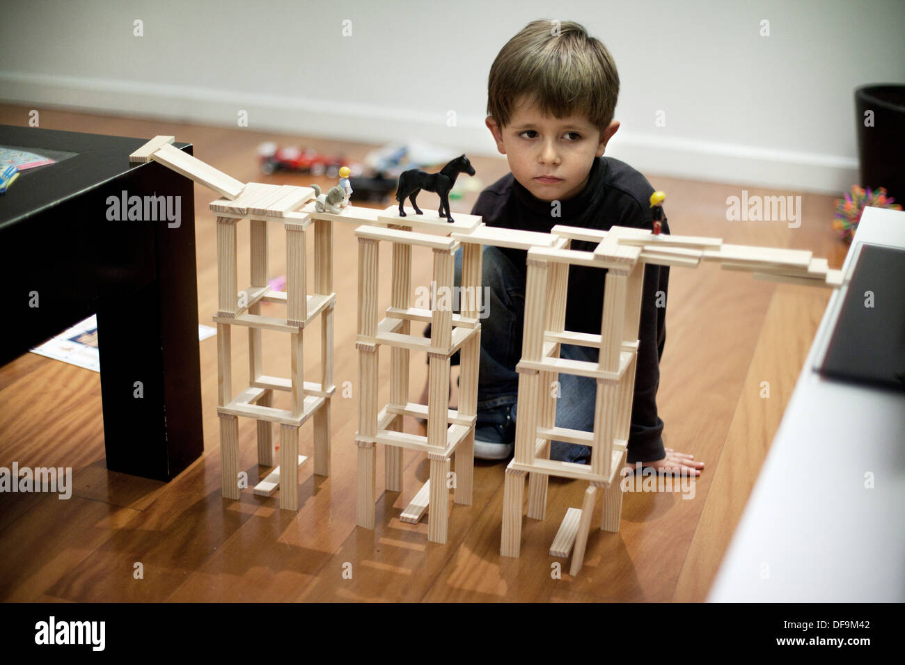 Child building bridge hi-res stock photography and images - Alamy