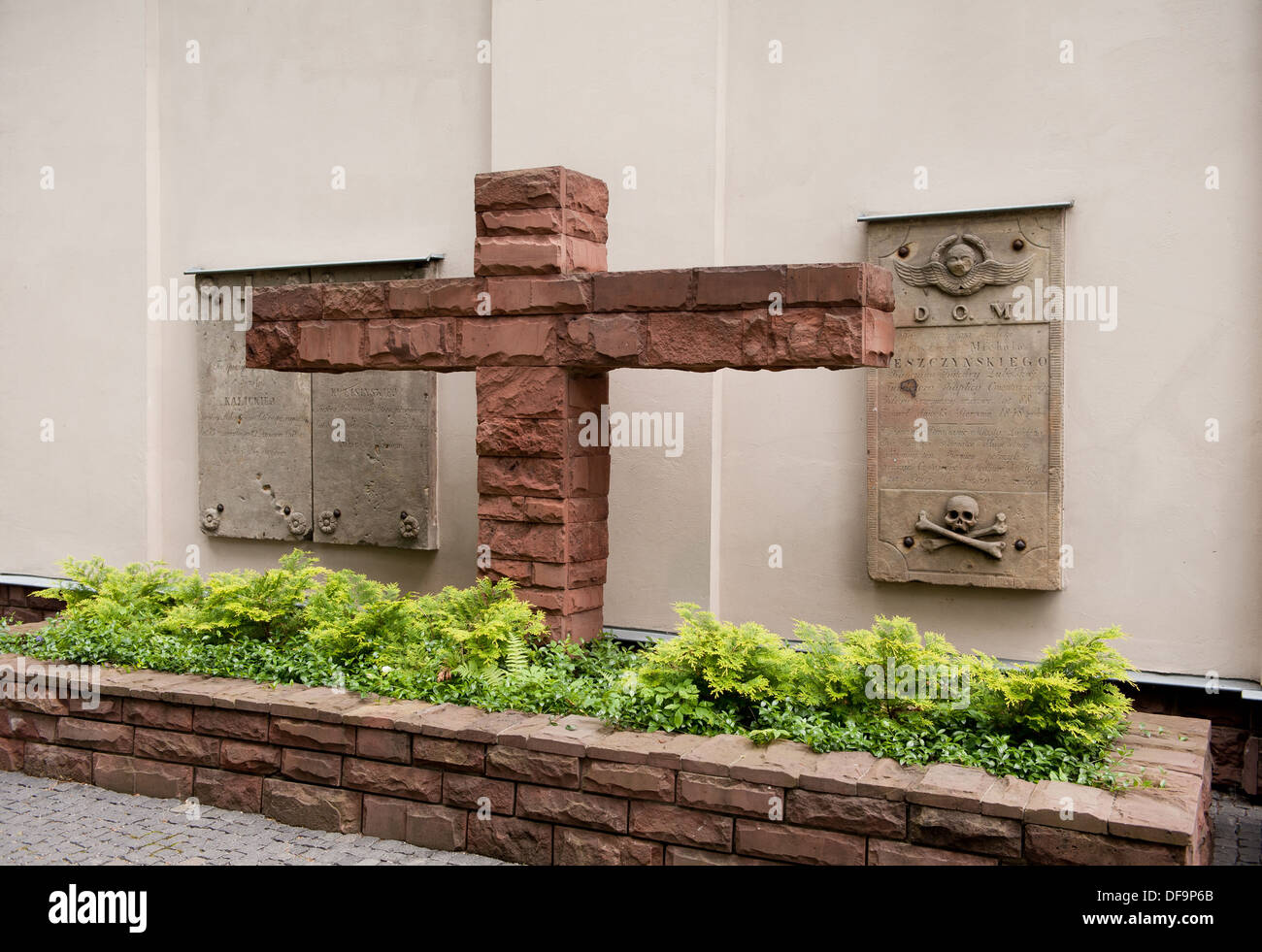 decorative cross of bricks on grave Stock Photo - Alamy