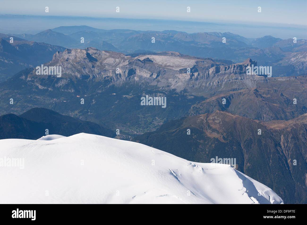 AERIAL VIEW. Snow-capped Dome du Goûter (4304m) and Désert de Platé ...