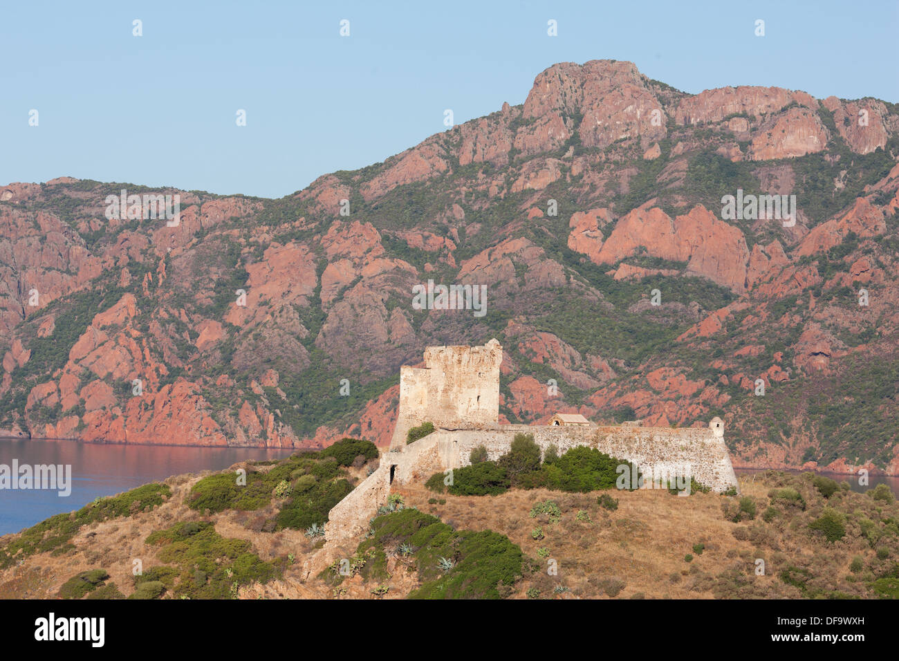 Genoese tower overlooking the Girolata Gulf, with the massive cliff of ...