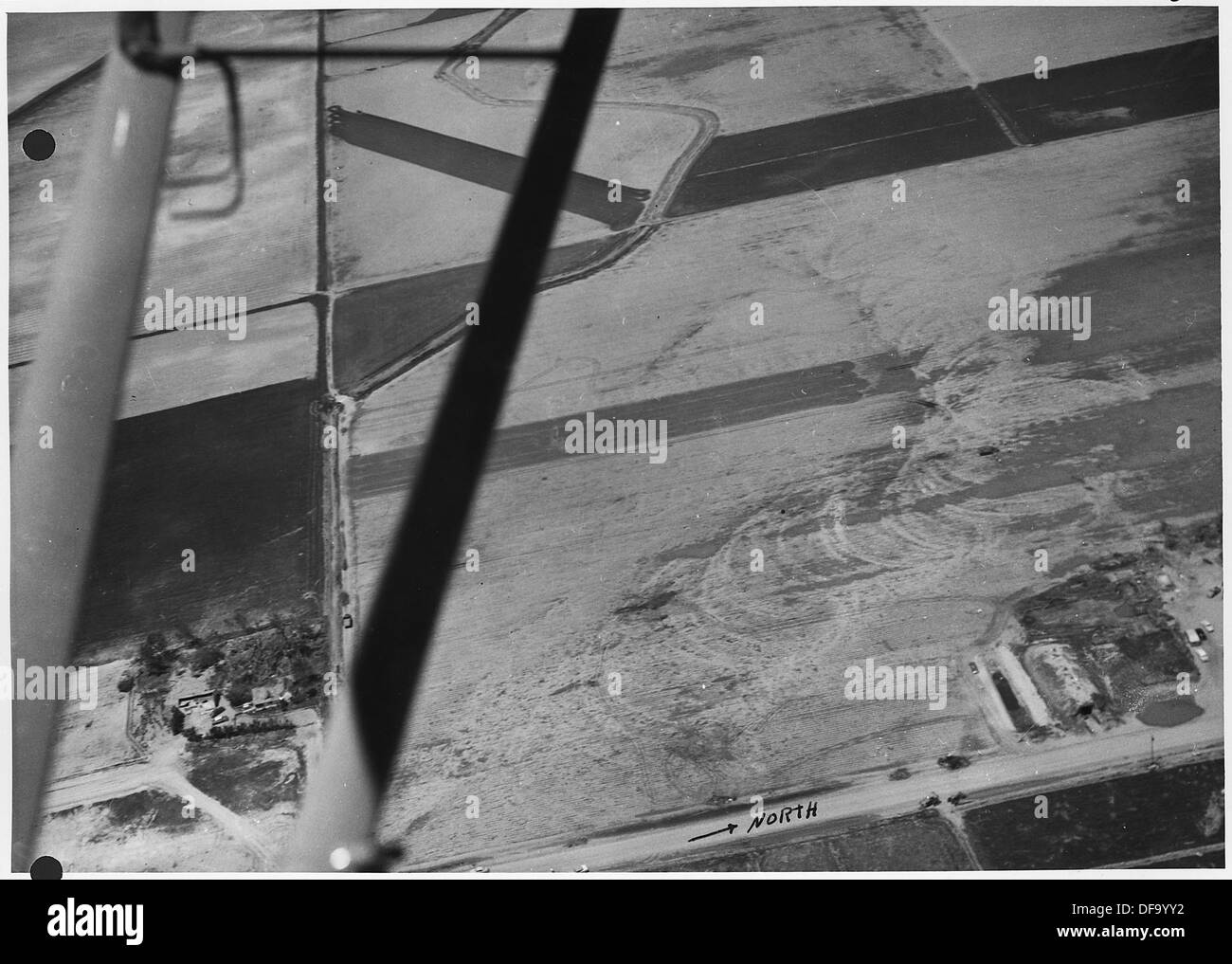 This image shows the scouring marks left on the ground by a tornado in ...