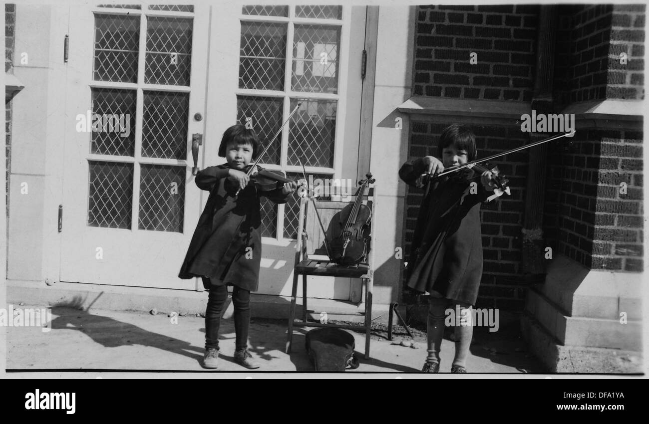 Two first graders playing violins 285426 Stock Photo - Alamy