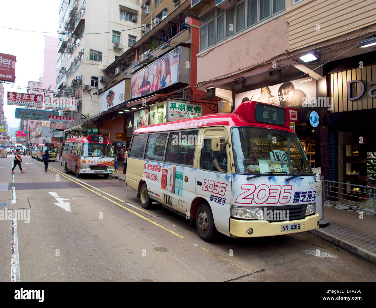 A red minibus waiting for passengers. These are used by locals for ...