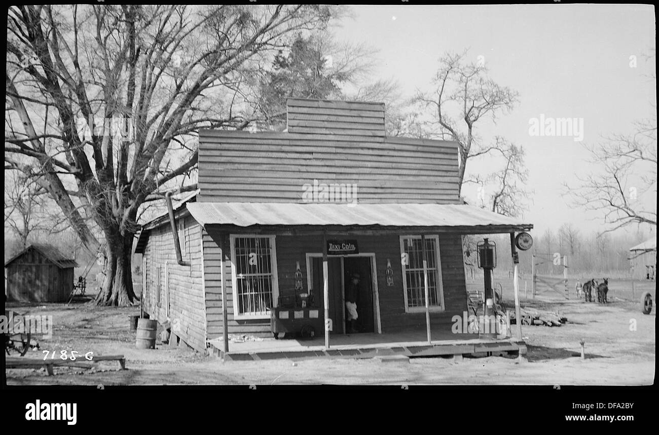 This photograph depicts a typical American farmstead with a Dixi-Cola ...