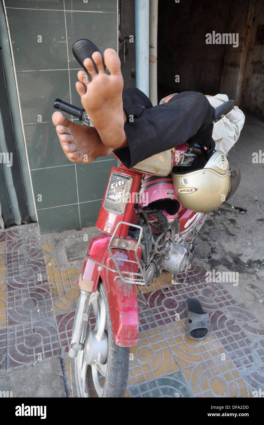 Man sleeping on motor bike hi-res stock photography and images - Alamy
