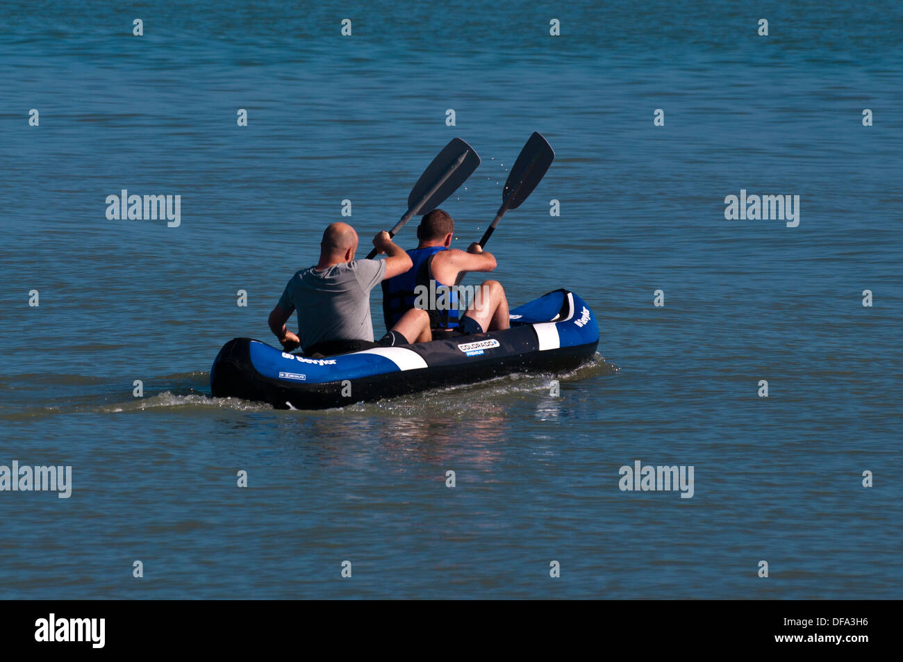 Two people paddling kayaks hi-res stock photography and images - Alamy