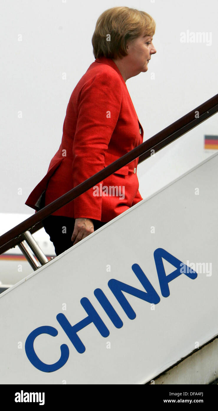 German chancellor Angela Merkel enters the airplane to fly back to ...