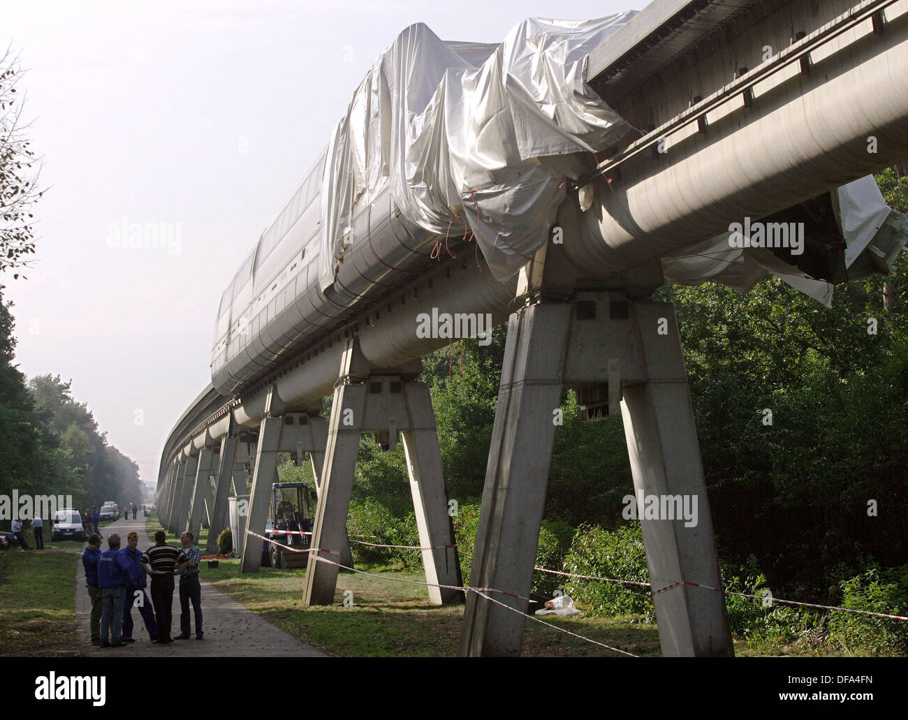 The wreckage of the Transrapid is covered on the 25th of September in ...