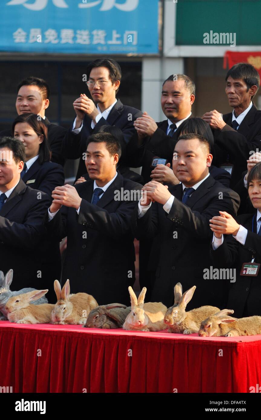 Dongguan (China): employees of a company posing for the photographer in ...