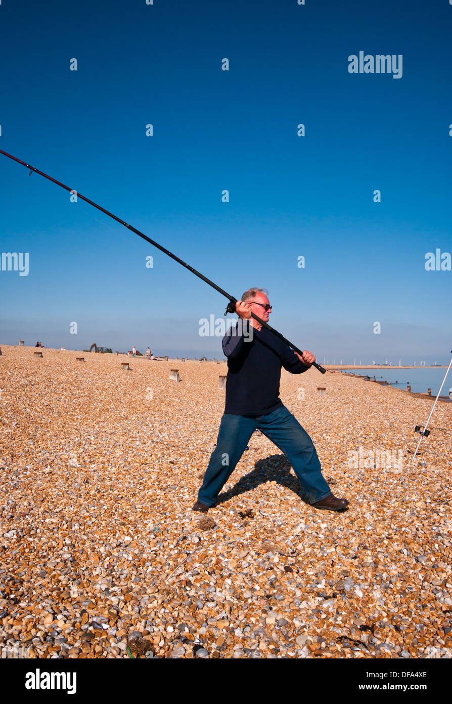 Beach Fisherman Casting Out To Sea Stock Photo - Alamy