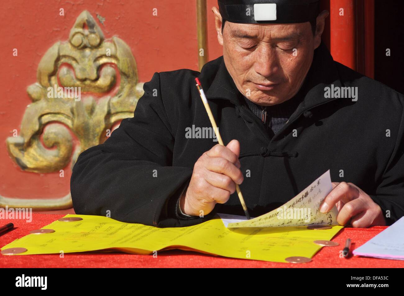 Priest writing chinese ideograms hi-res stock photography and images ...