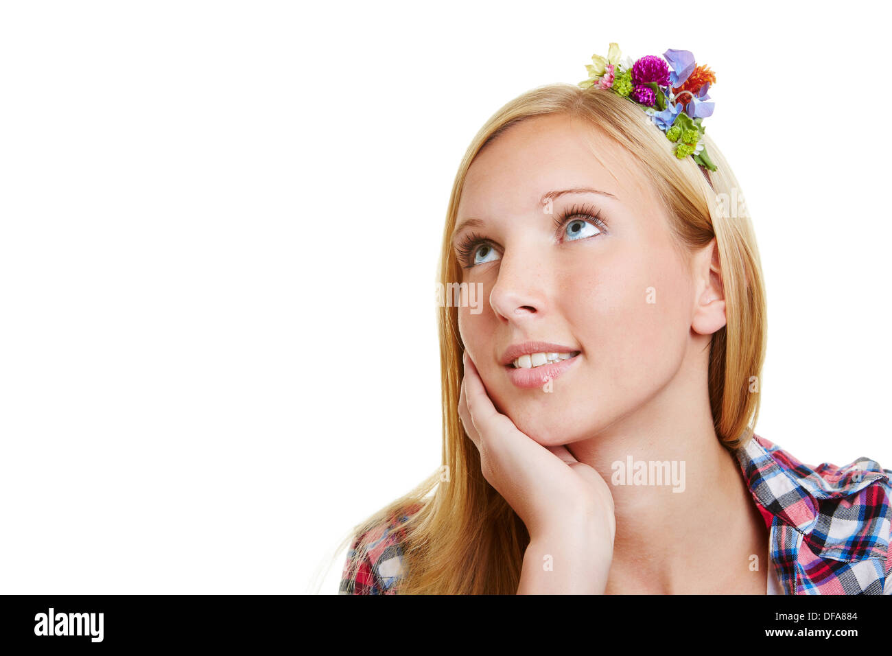 Pensive young blond woman looking up thinking Stock Photo - Alamy