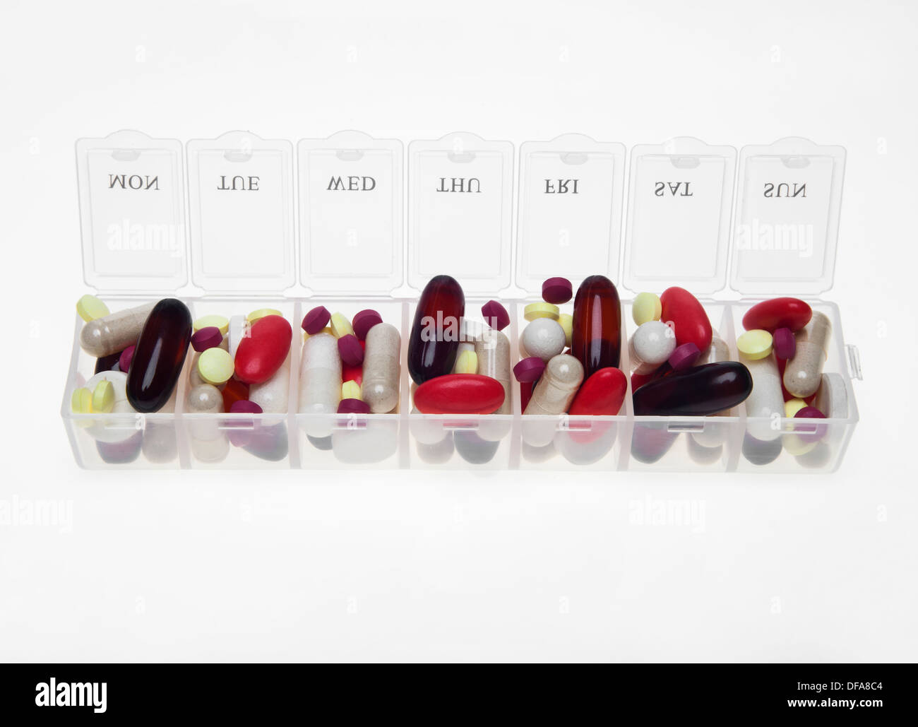 Pill box with variety of pills and supplement Stock Photo - Alamy