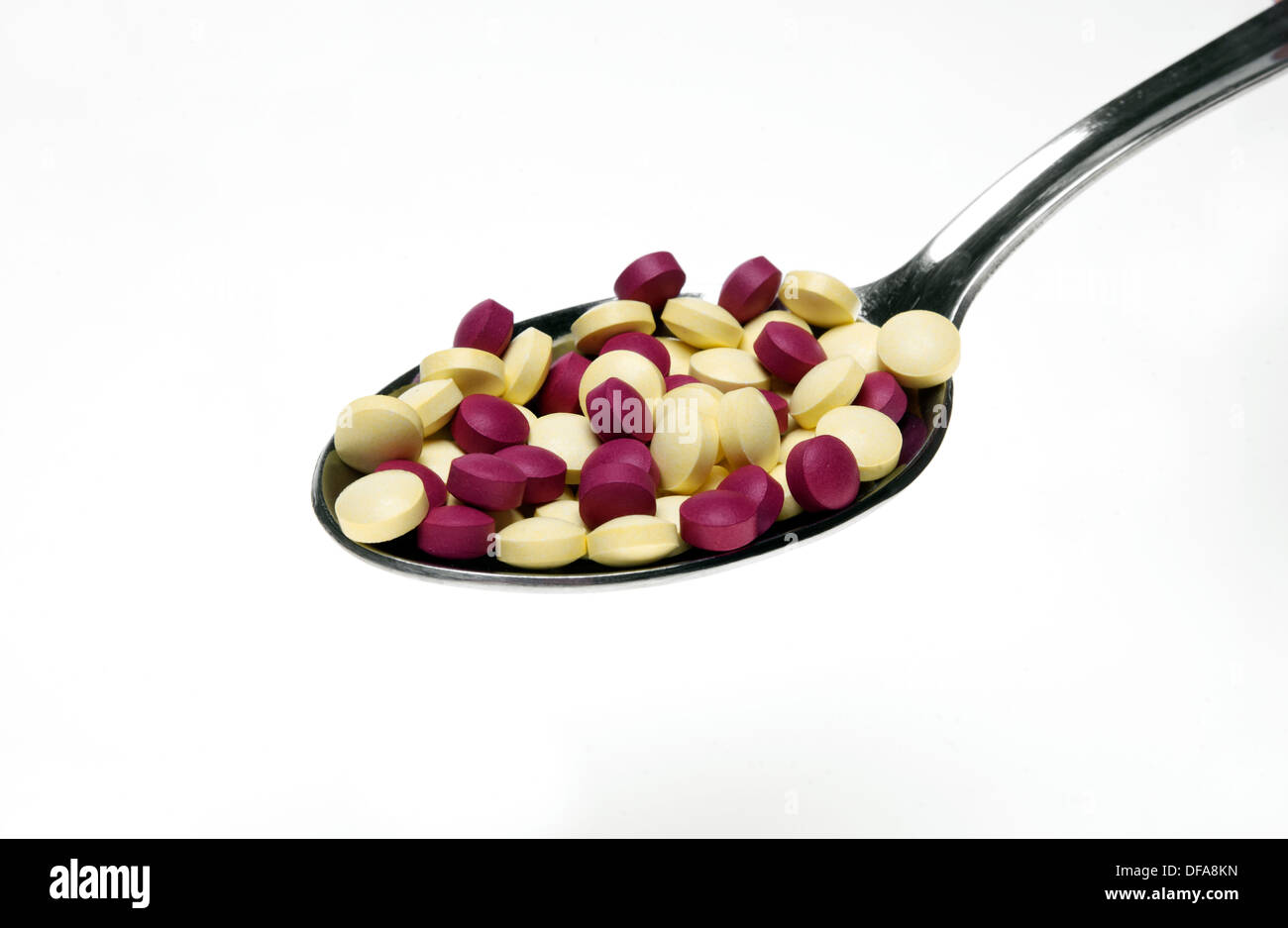 Colorful vitamin capsules on a spoon Stock Photo - Alamy