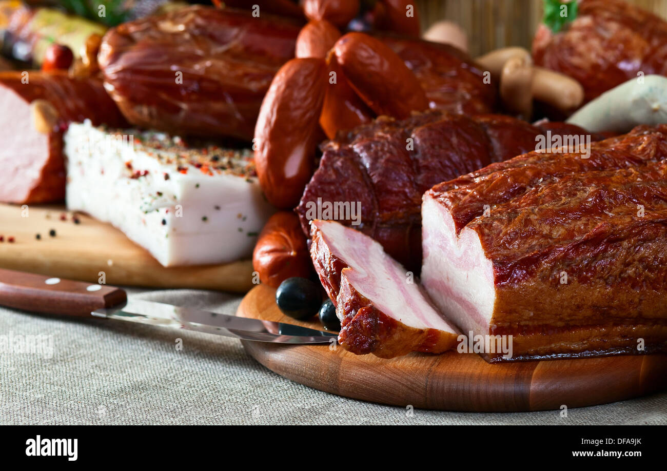 smoked meat and sausages on a linen cloth Stock Photo - Alamy