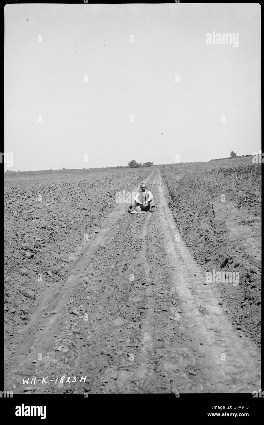 The photograph features a white farm, possibly owned by Mr. White ...