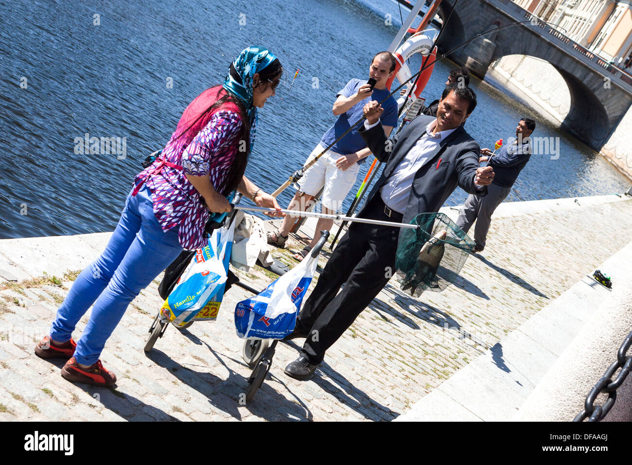 Man catching fish hi-res stock photography and images - Alamy