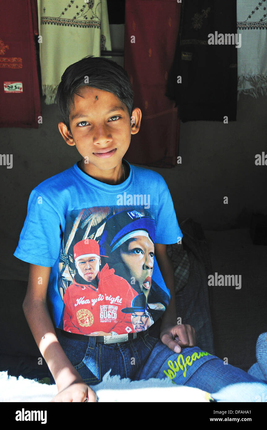 Boy selling traditional shaw at the little shop by the quiet main ...