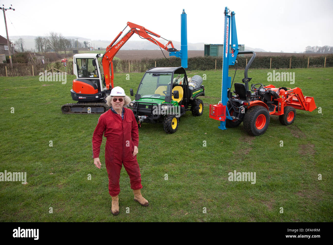 Workmen ready to create a fence using a Post Punching Machine UK Stock ...