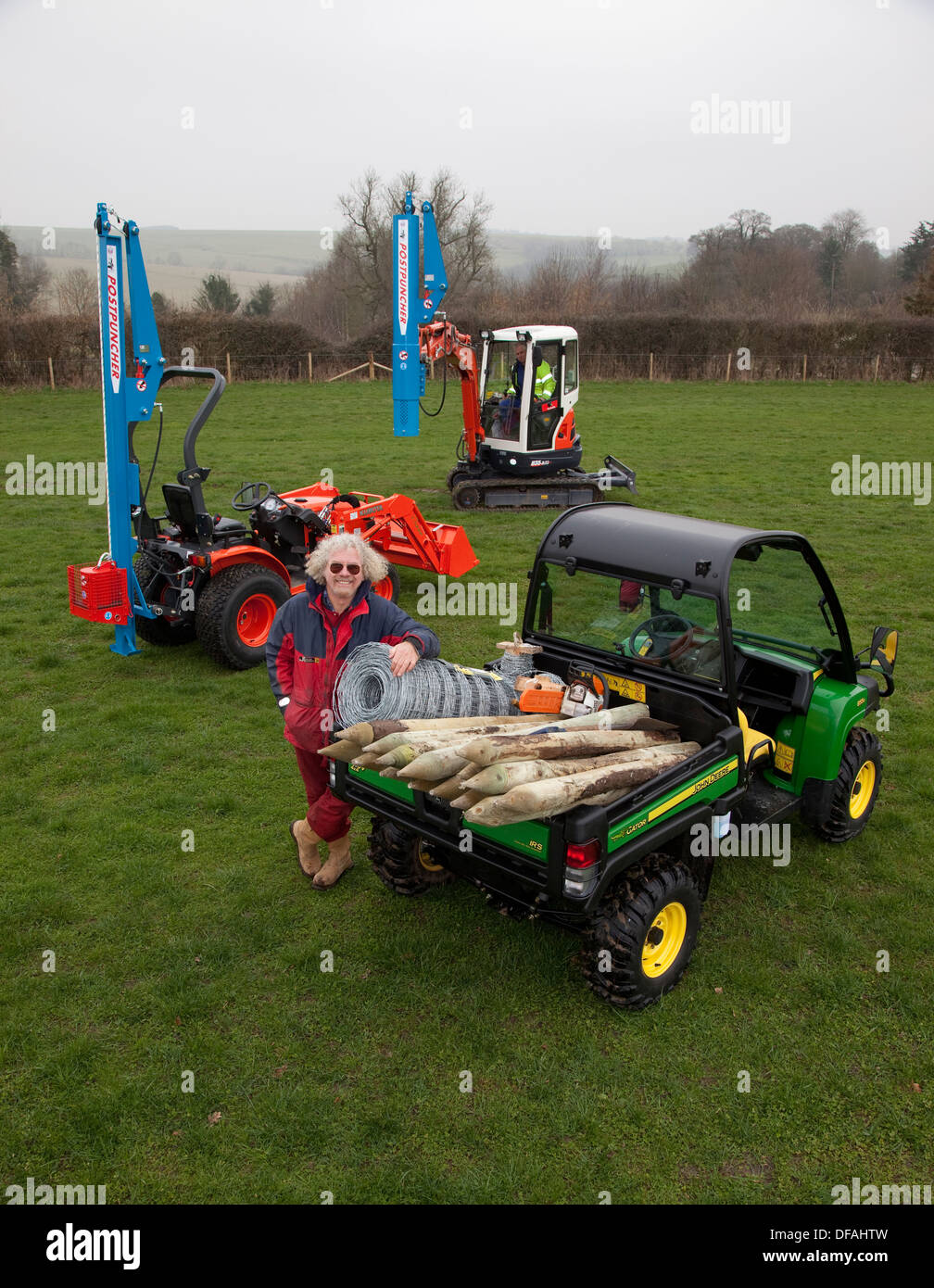 Workmen ready to create a fence using a Post Punching Machine UK Stock ...