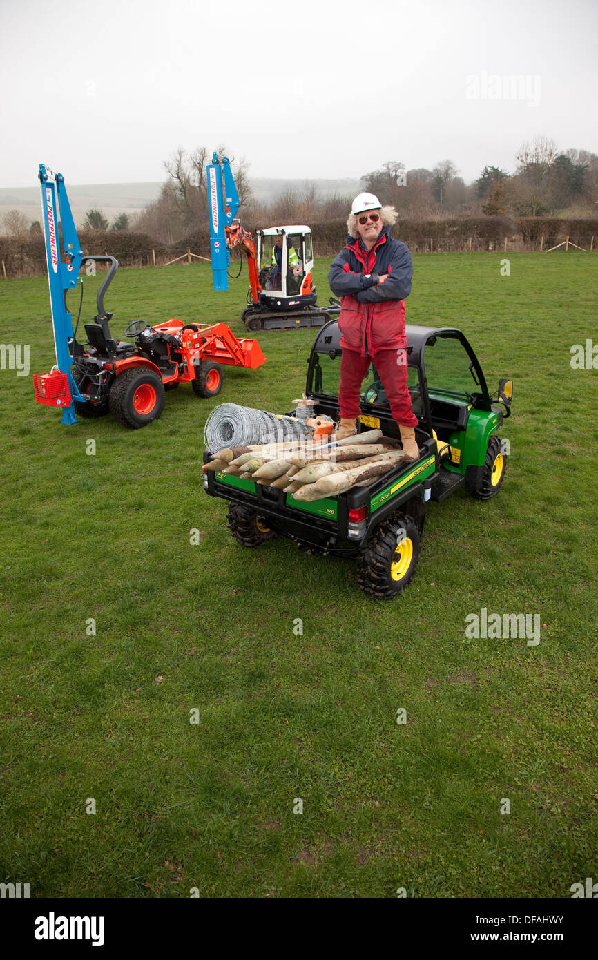 Workmen ready to create a fence using a Post Punching Machine UK Stock ...