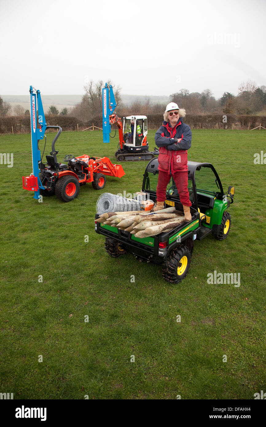 Workmen ready to create a fence using a Post Punching Machine UK Stock ...