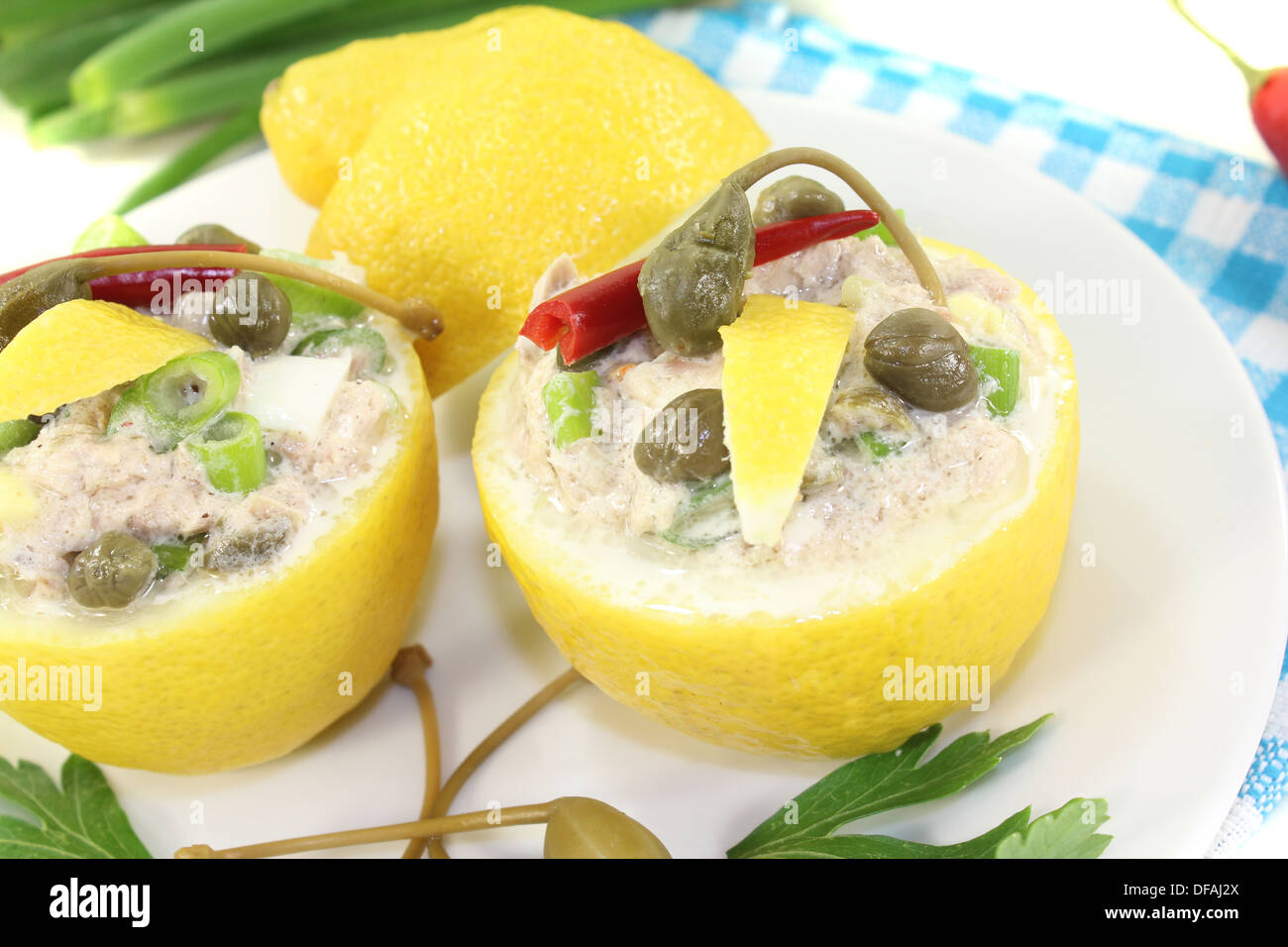 stuffed Lemons with tuna cream and eggs on a light background Stock ...