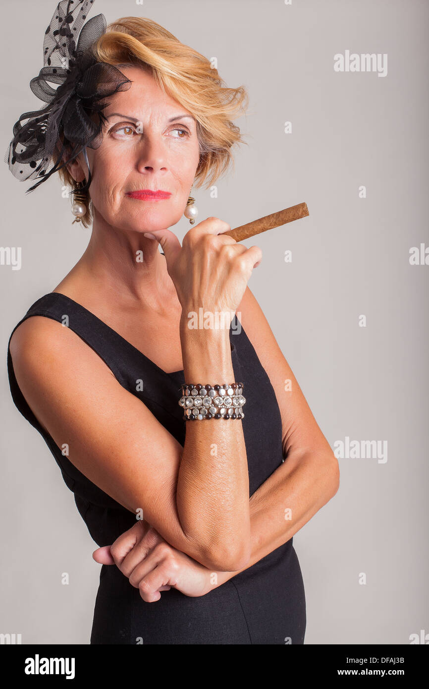 Elegant woman with a cigar Stock Photo - Alamy