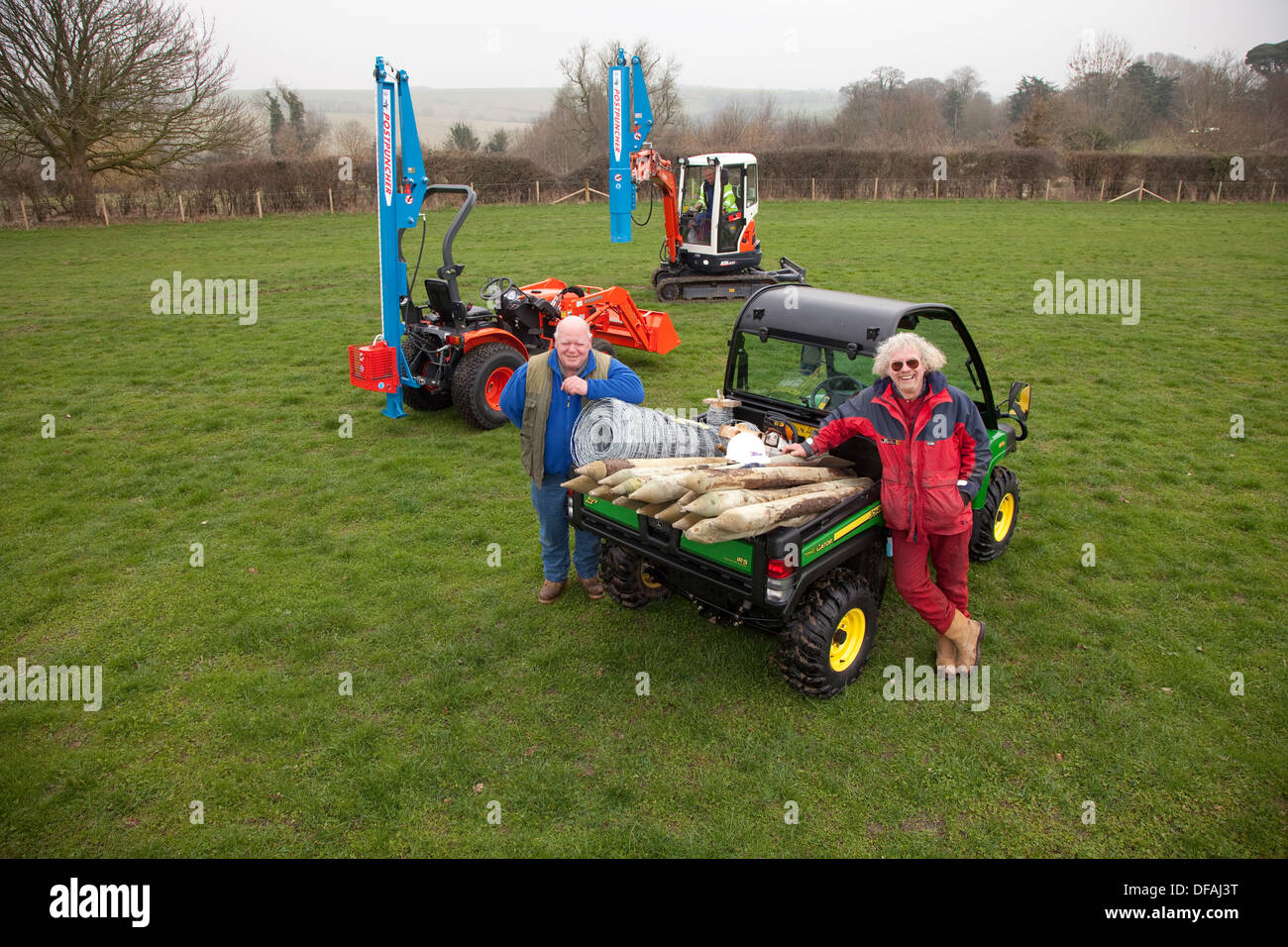 Workmen ready to create a fence using a Post Punching Machine UK Stock ...