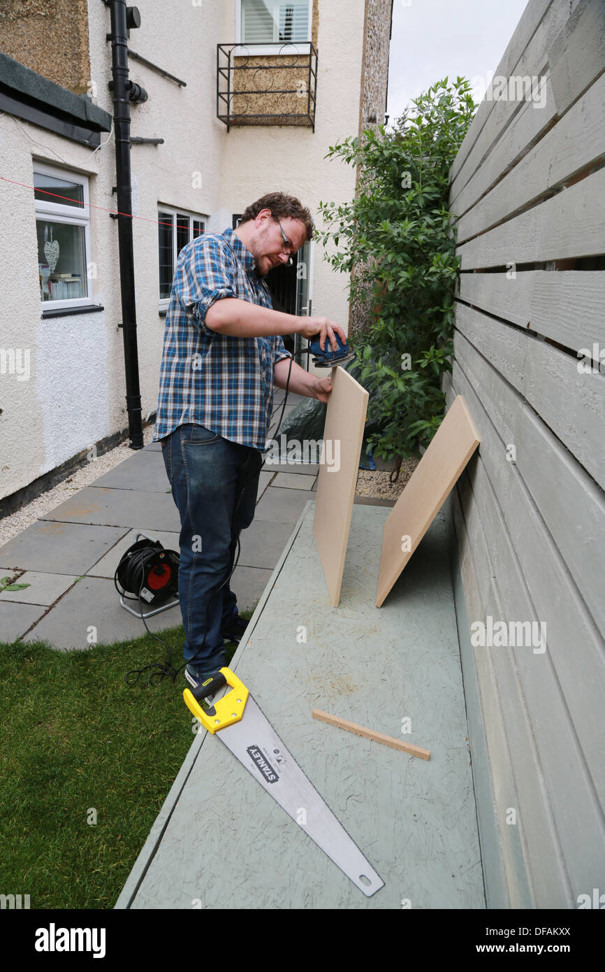 Man doing diy hi-res stock photography and images - Alamy