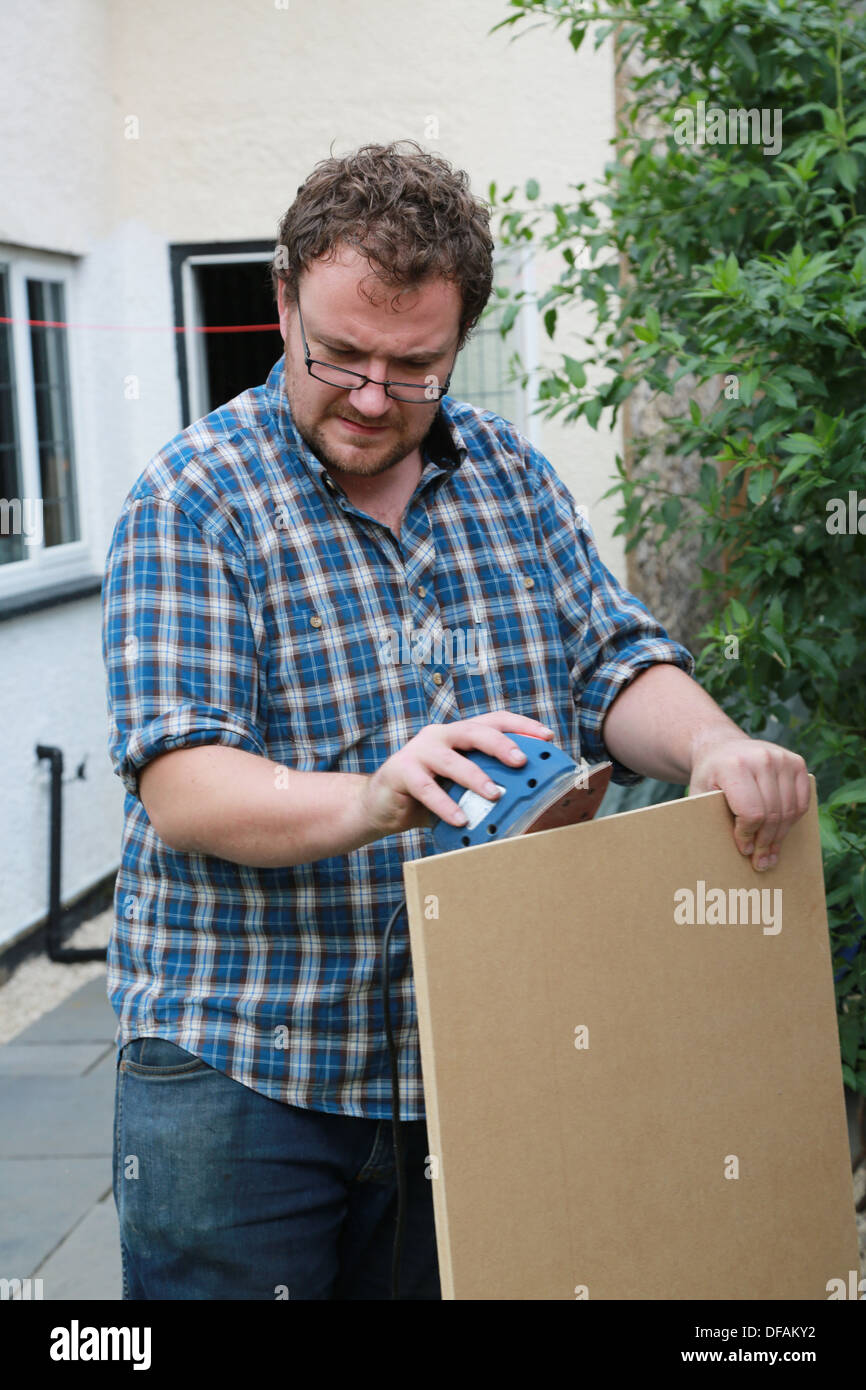 Man doing diy hi-res stock photography and images - Alamy