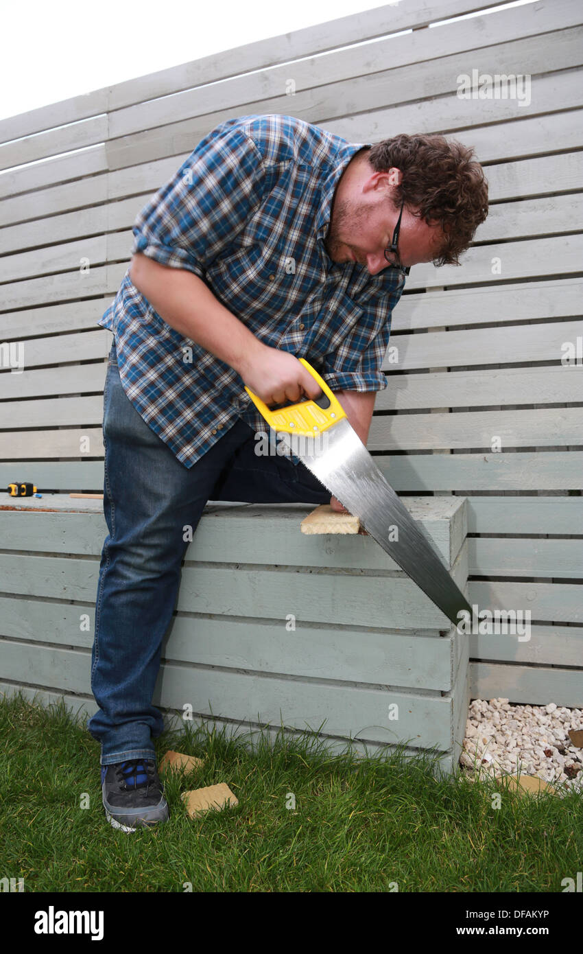 Person sawing hi-res stock photography and images - Alamy