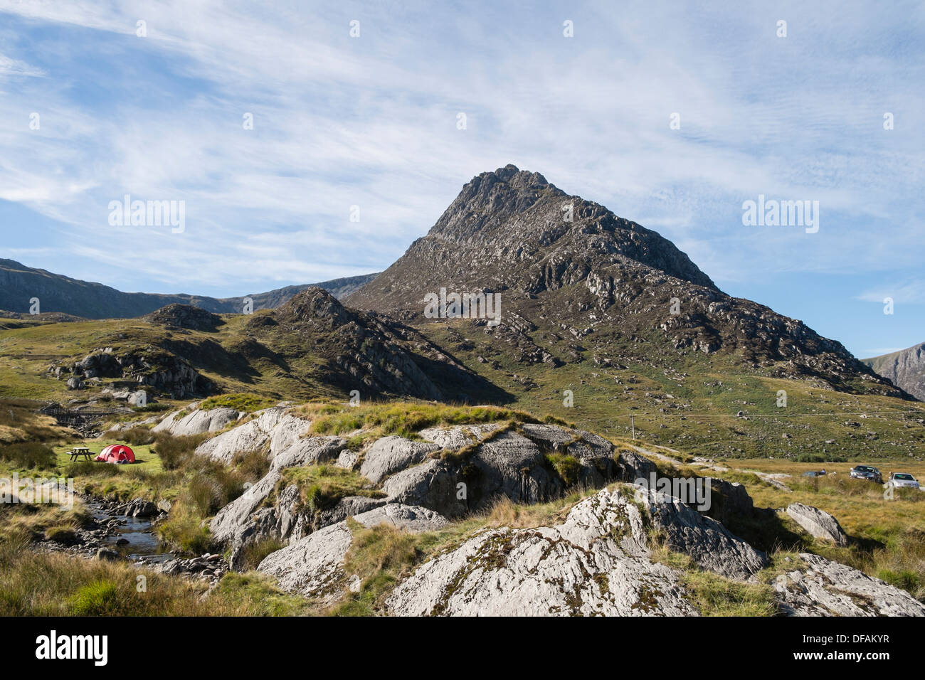 Tent camped by a stream on Willie's Farm campsite below Mount Tryfan in ...
