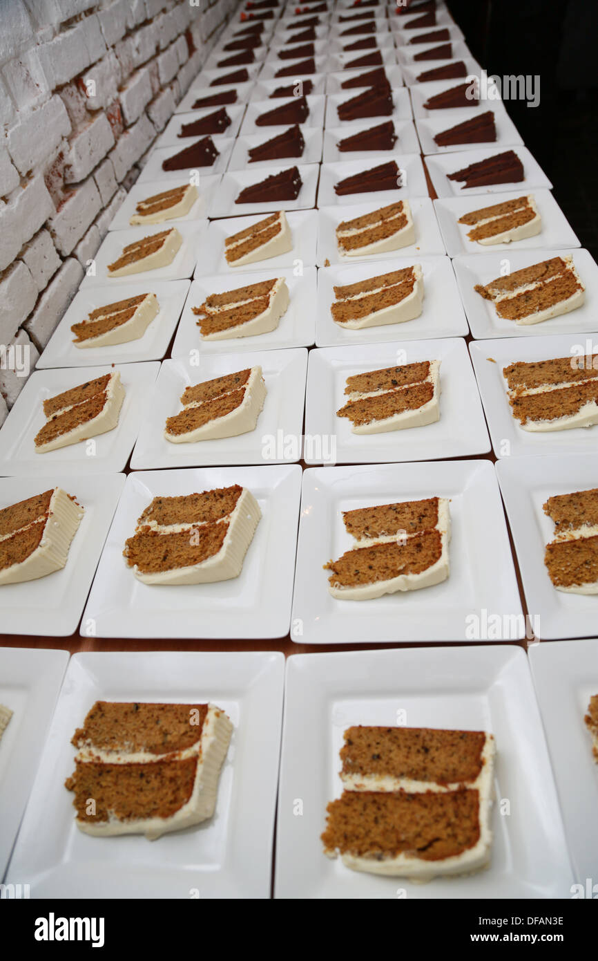 Portions of cake ready to be served at a venue Stock Photo - Alamy