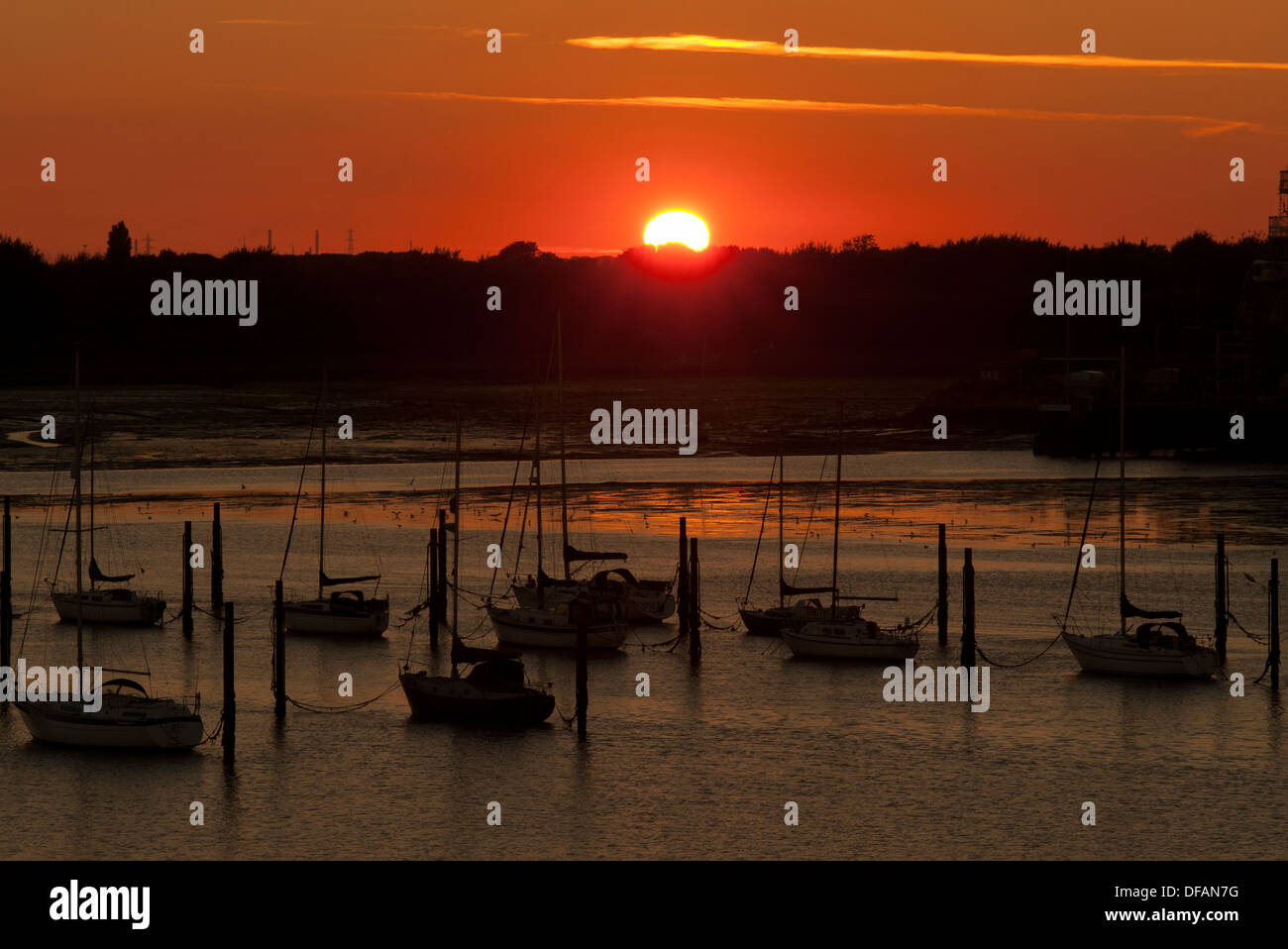 sunset over water Stock Photo - Alamy