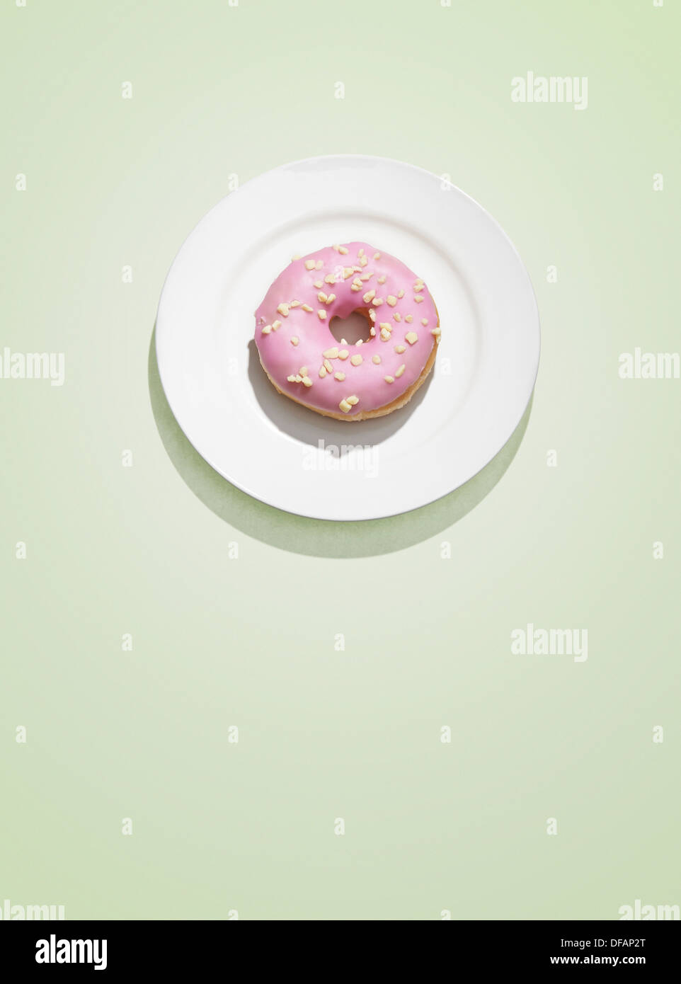Pink iced donut hi-res stock photography and images - Alamy