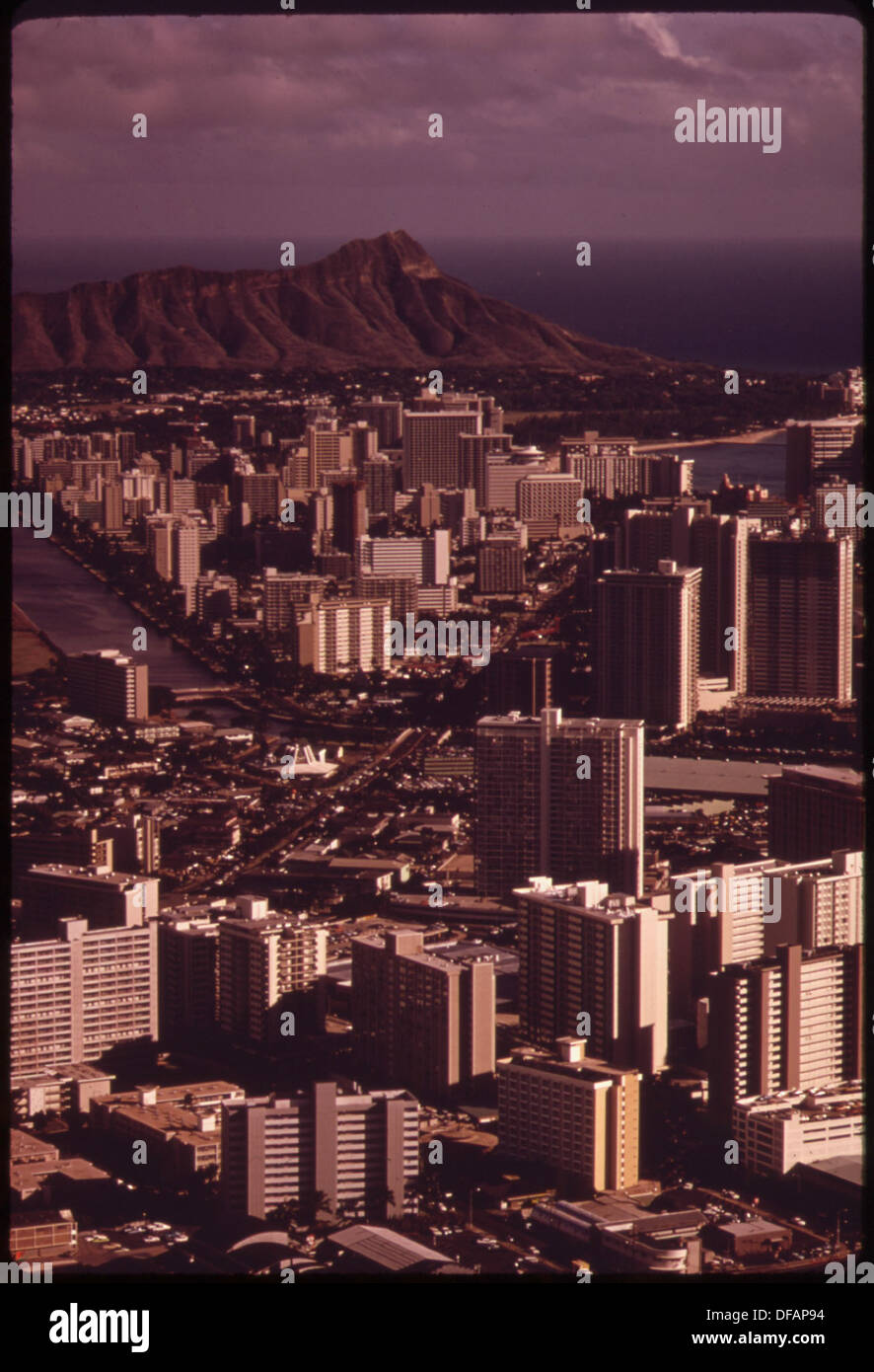 This aerial view of Honolulu captures the iconic Diamond Head, an ...