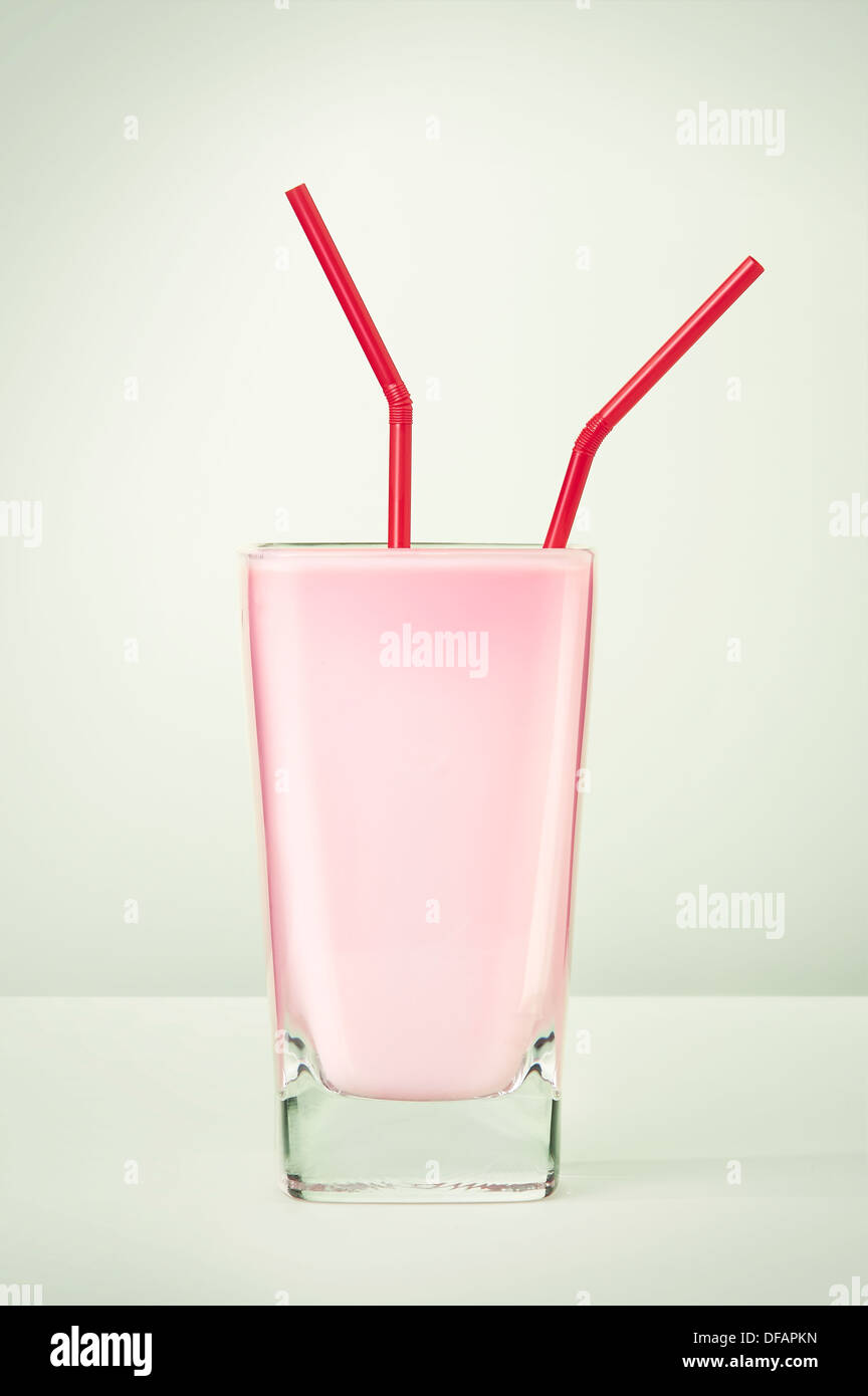 Strawberry milkshake with two straws for sharing Stock Photo - Alamy