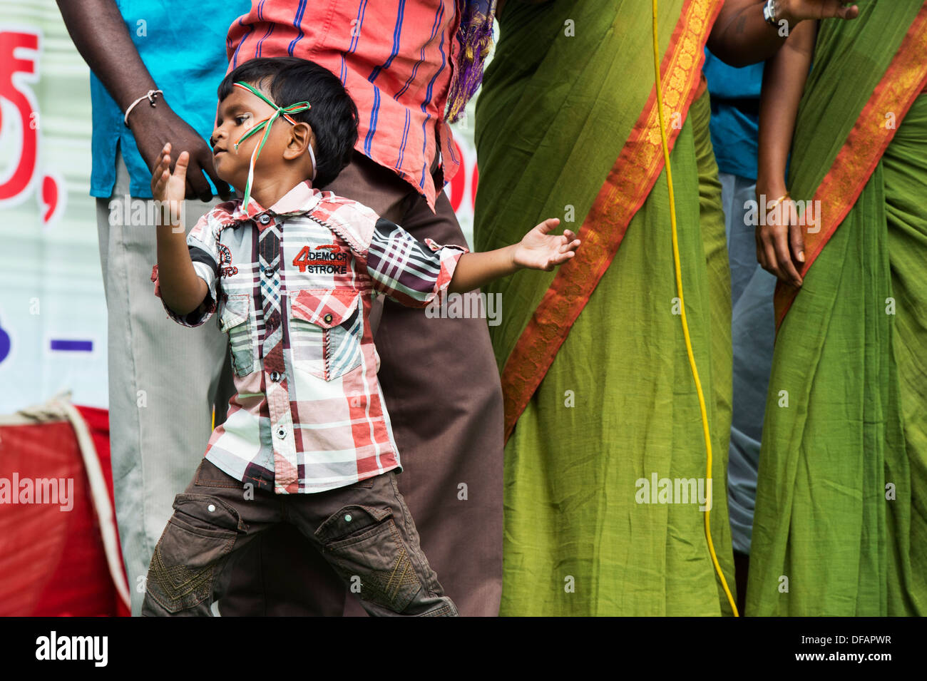 Very Young Indian boy dancing on stage at a protest rally. Puttaparthi ...
