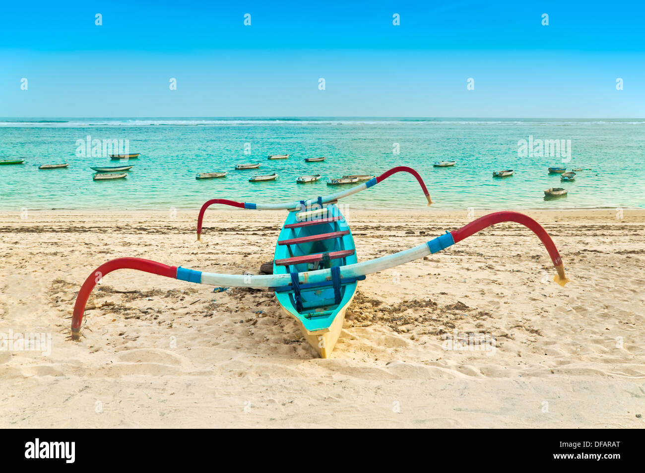 Old and typical paddling boat on the beach Stock Photo - Alamy
