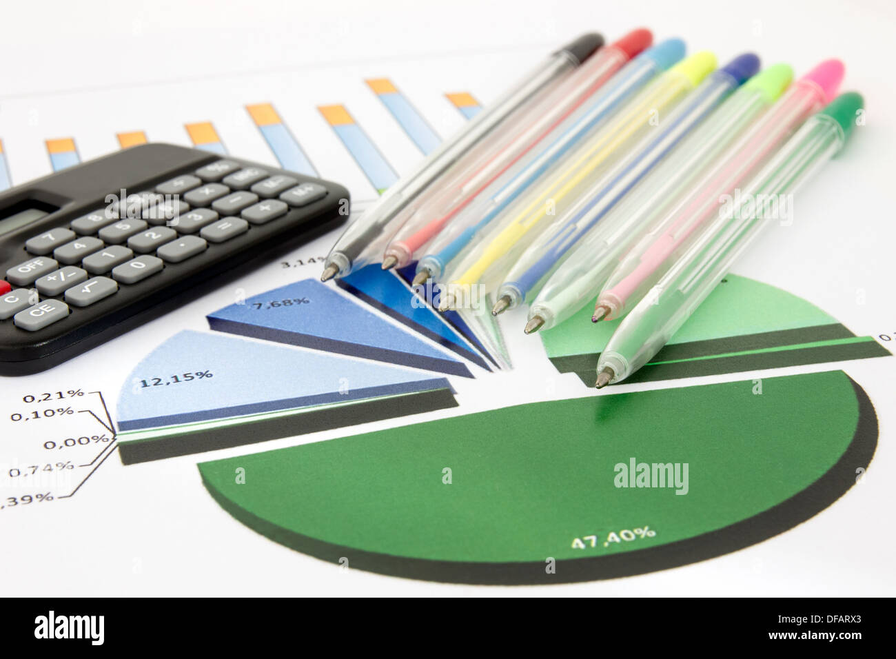 Business chart with a calculator and pile of colored pens Stock Photo ...