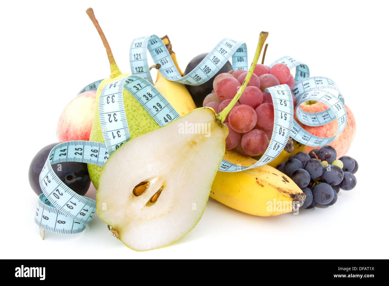 Measure tape and fruits composition over a white background Stock Photo ...