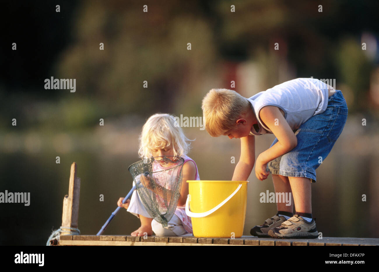 Boy fishing small dock hi-res stock photography and images - Alamy