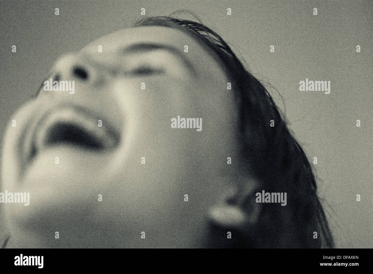 out of focus picture of a girl laughing upwards Stock Photo - Alamy