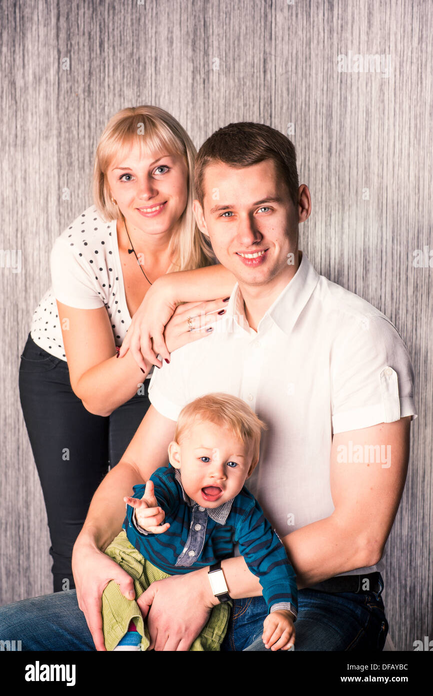 Portrait of a happy family: mother, father and a baby Stock Photo - Alamy
