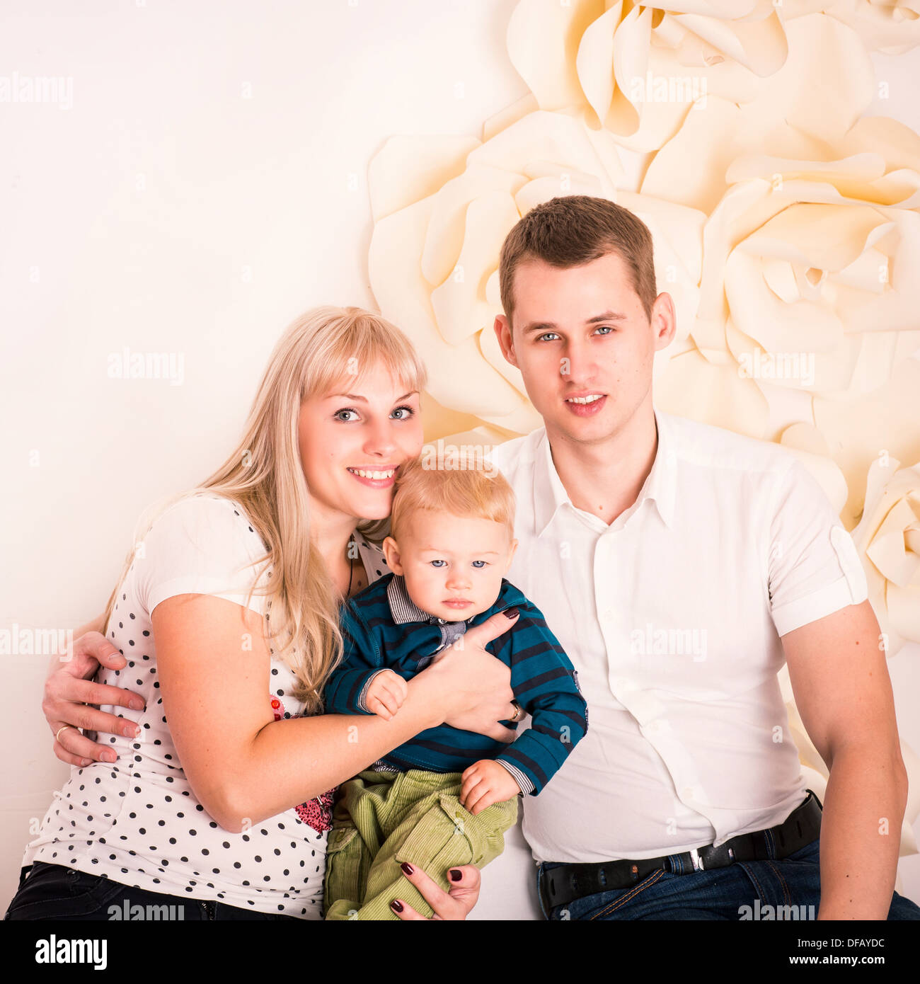 Portrait of a happy family: mother, father and a baby Stock Photo - Alamy